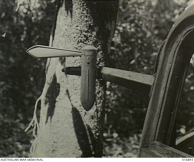 Gasmata, New Britain. A traffic stop sign on a deserted Japanese petrol ...