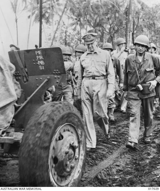 Dutch New Guinea. General MacArthur walks behind a field (possibly 25 ...