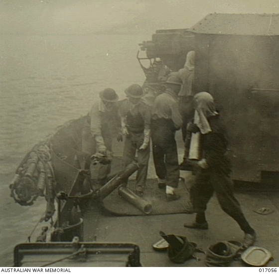 Dutch New Guinea. The warship, HMAS Arunta's guns blast away at ...