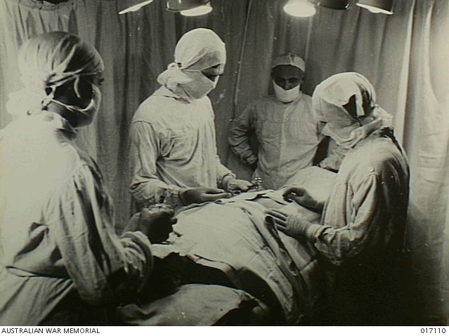 Naval surgeons on HMAS Shropshire performing an appendectomy operation ...