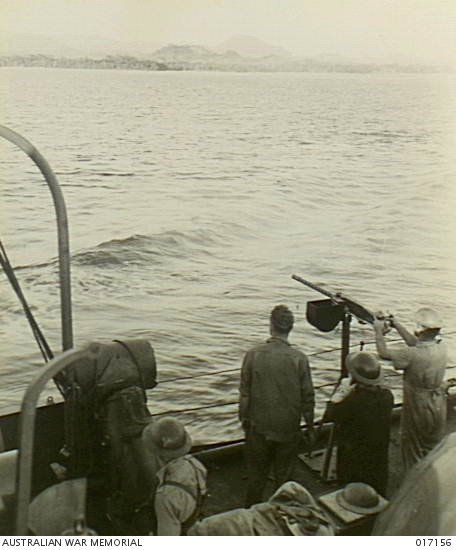 Oerlikon machine gun on HMAS Kapunda fires at suspected Japanese posts ...
