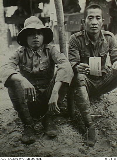 New Guinea. Two Javanese prisoners of war (POWs) who were used as ...