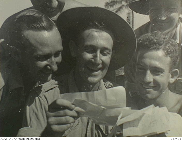 Lae, New Guinea. Corporal Bill Cranfield of Artarmon, NSW, shows a ...