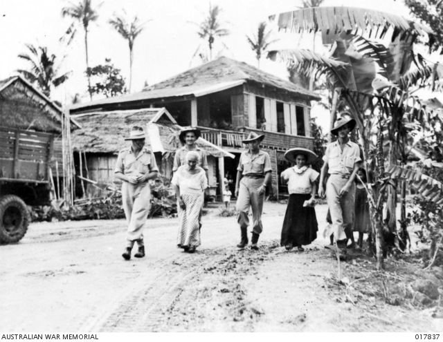 Tacloban, Leyte Island, Philippines. RAAF airmen making friends with ...