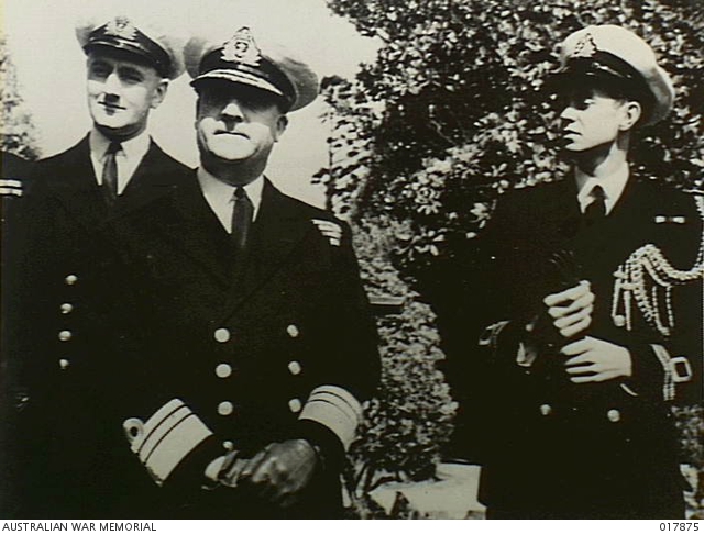 In the grounds of the building, Lieutenant Commander R. N. Heard (left ...
