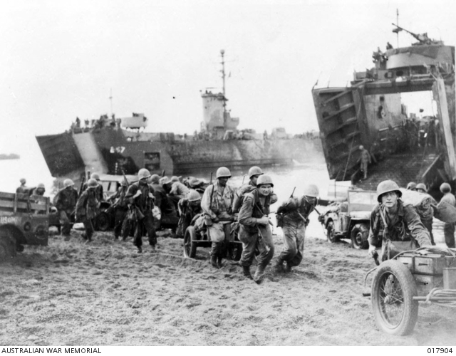 Ormoc Bay, Leyte, Philippines. American troops hauling ammunition on ...