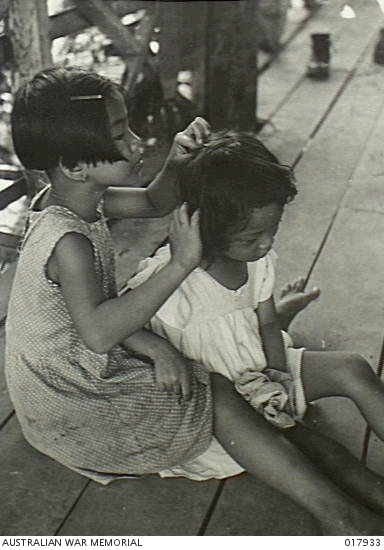 Leyte, Philippines. On the stairs of their home in Tacloban, one little ...