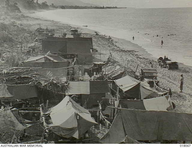 Aitape, New Guinea. Nestled in the corner of a cliff on the beach ...