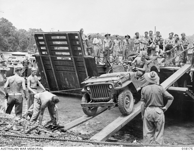 New Britain. Planks are used to enable a jeep to be unloaded from one ...