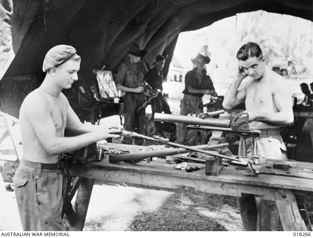 Henry Reid Bay, New Britain. Weapons being repaired in the workshop by ...