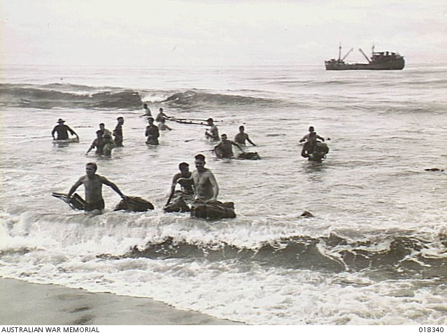 1945. Soldiers carrying equipment through the surf. | Australian War ...