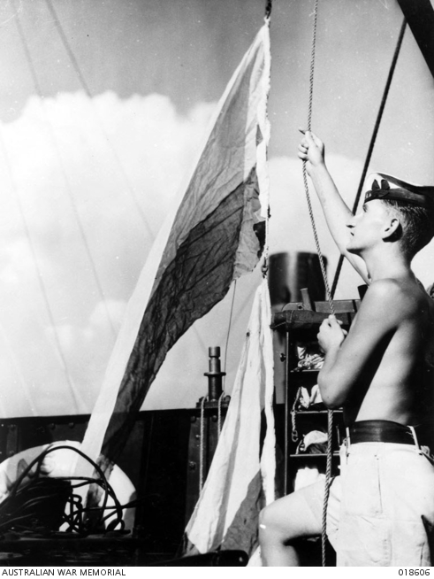 Pacific Area 53. 1945. Hoisting signal flags on HMAS Lachlan is ...