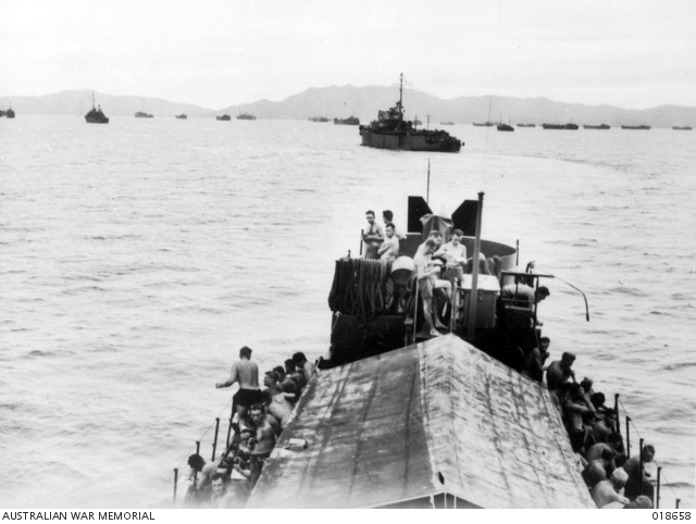 Borneo. 9 June 1945. A convoy at dusk passing Balabak Island en route ...
