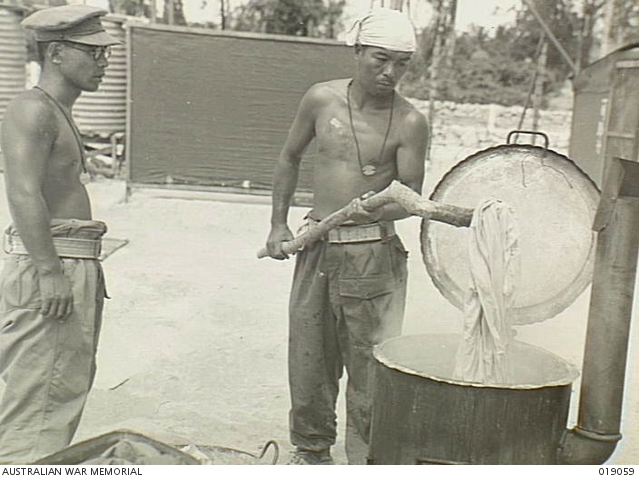 Morotai, Halmahera Islands. 1945. Washing facilities are provided at ...