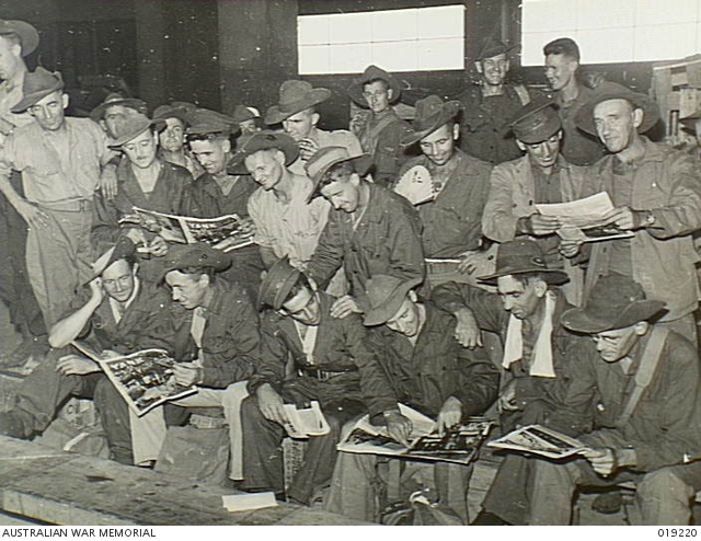Japan. 1945. A group of Australians catch up with some reading that ...