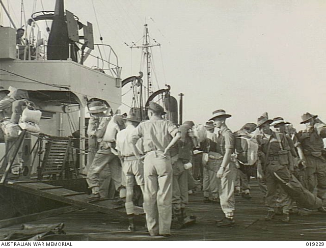 1945. Troops embarking on HMAS Parkes for the occupation of Timor ...