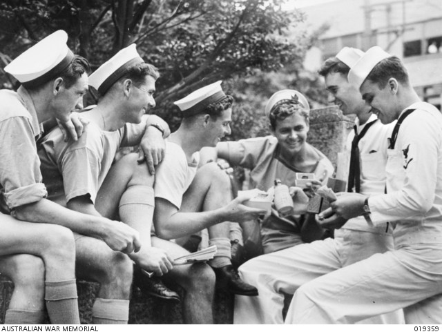 Yokohama, Japan. Men from HMAS Nepal on shore leave in Yokohama rest on ...