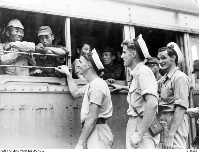 Yokohama, Japan. September 1945. Three ratings from HMAS Nepal talking ...