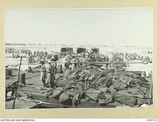 Waterfront scene at Mersa Matruh as HMAS Vendetta berthed with a large ...