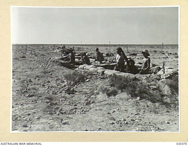 Men of the 9th Division, on the alert for the enemy, man an outpost ...