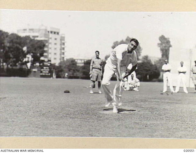 A bowler in action during the first practice of the 1941 A.I.F. Cricket ...