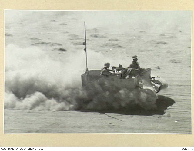 A Bren Gun Carrier of the 24th Infantry Brigade moving at full speed to ...