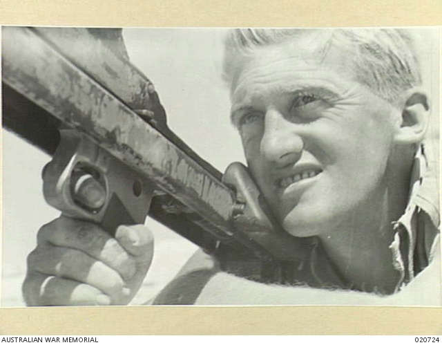 VX18855 Gunner Jeffrey John Coombe of Launceston, Tasmania, behind his ...