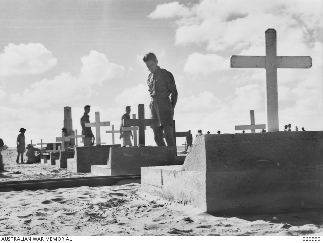 Australian soldiers paying their respects at the graves of their ...