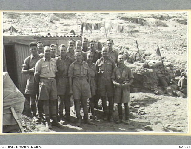 Informal group portrait of personnel outside the NCO’s Mess at the 9th ...
