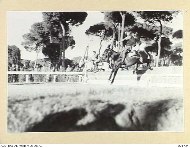 BEIRUT, SYRIA. 1941-11-22. JUMPING THE THIRD HURDLE DURING THE ALLIED ...
