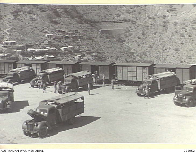 NEFASIT, ERITREA. 1941-11. ARMY TRUCKS LOADING GEAR AND SUPPLIES FOR ...