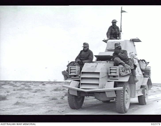 FORT CAPUZZO, LIBYA. 1941-12. TWO GERMAN PRISONERS ON THE FRONT OF A ...