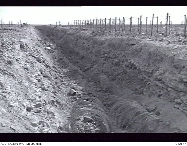 BARDIA, LIBYA. 1941-12. A TANK DITCH AND WIRE ENTANGLEMENTS AT THE ...