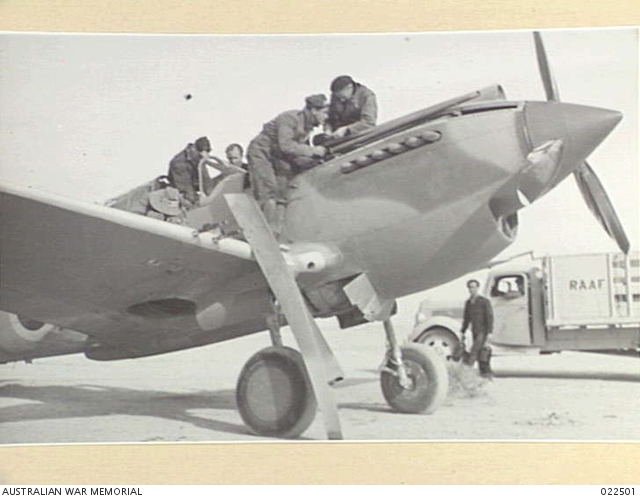 LIBYA. 1941-12. NO. 3 SQUADRON, RAAF, GROUND STAFF SERVICING A TOMAHAWK ...