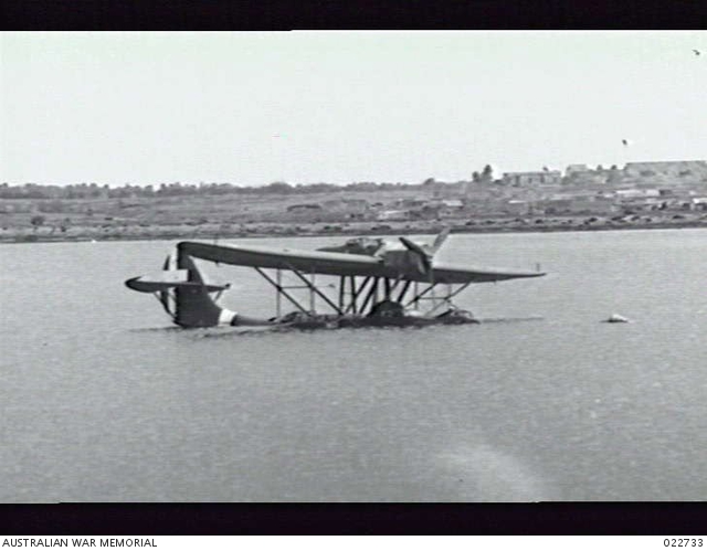 BENGHAZI, LIBYA. 1941-12-27. A WRECKED ITALIAN SEAPLANE IN THE HARBOUR ...