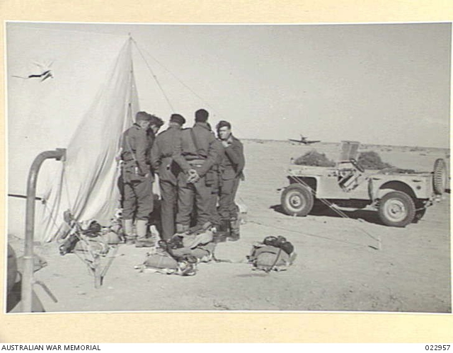 LIBYA. 1942-01-02. PILOTS OF NO. 3 SQUADRON RAAF DISCUSSING OPERATIONAL ...