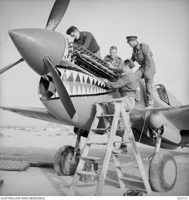 LIBYA. 1942-01-08. MEMBERS OF NO. 112 SQUADRON, R.A.F. SERVICING ONE OF ...