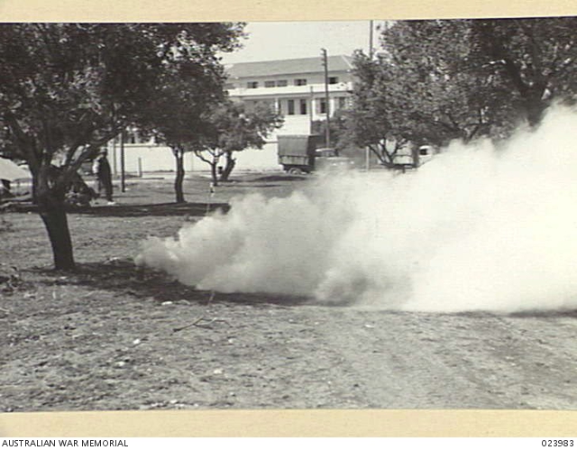 TRIPOLI, SYRIA. 1942-03-27. A GAS BOMB SIMULATING PHOSGENE GAS CLOUD ...
