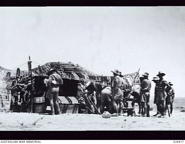 FORGLOSS, SYRIA. 1942-06-18. PAY PARADE AT ADVANCED HEADQUARTERS, 9TH ...