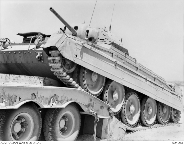 Stage three in loading a tank onto a trailer for transportation to ...