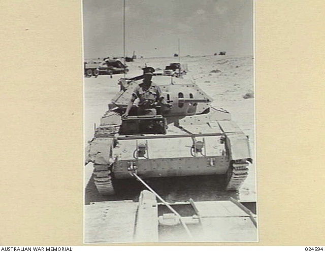 Stage one in loading a tank on to a multi wheeled scammel transport ...
