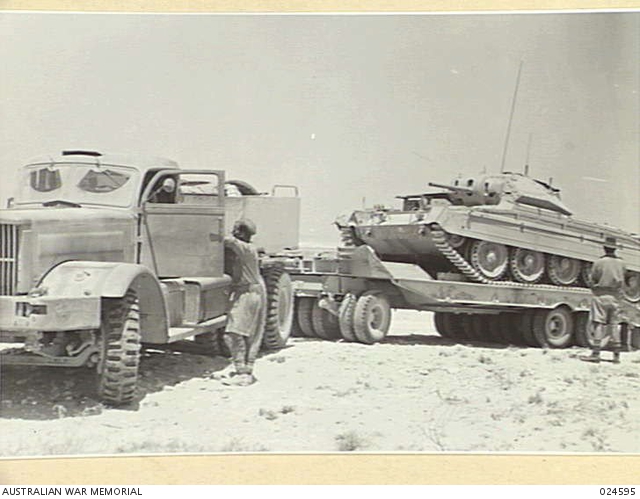 Stage four in loading a tank on to a multi-wheeled Scammel transport ...