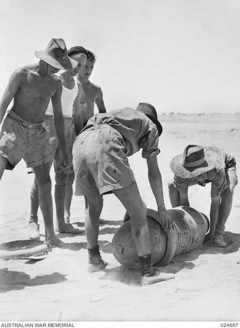AUSTRALIAN BOMB ARMOURERS ATTACHED TO NO. 450 SQUADRON, ROYAL AIR FORCE ...