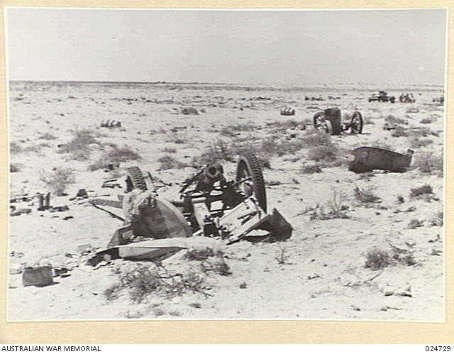 WESTERN DESERT, EGYPT. 1942-07-31. WRECK OF GERMAN GUN AND AMMUNITION ...