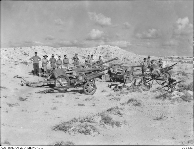 WESTERN DESERT, EGYPT. 1942-11-02. HAUL OF ENEMY GUNS AND EQUIPMENT ...