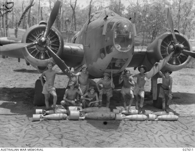 Members of the crew and ground staff standing in front of a Lockheed ...