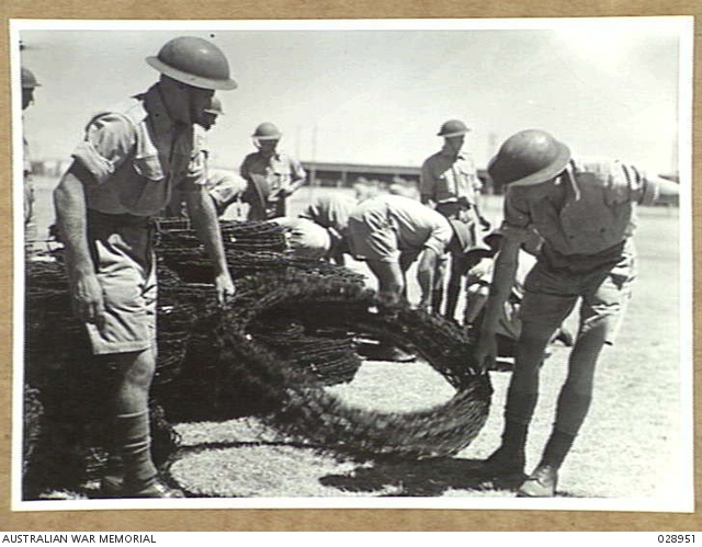 PERTH, AUSTRALIA. 1943-01-16. PREPARING BARBED WIRE OBSTACLE FOR A ...