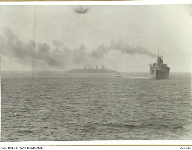 HMAS AUSTRALIA, AT SEA. 1943-02. THE TROOPSHIPS "AQUITANIA" (CENTRE ...
