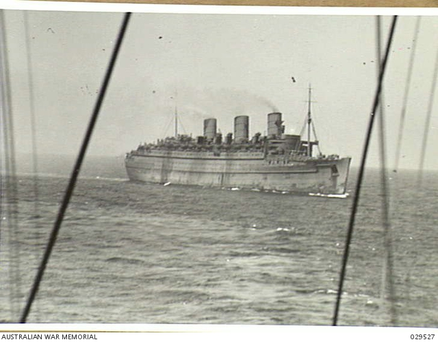 HMAS AUSTRALIA, AT SEA. 1943-02. CLOSE-UP OF THE TROOPSHIP "QUEEN MARY ...