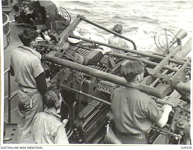 HMAS AUSTRALIA, AT SEA. 1943-02. CREW OF A QUICK FIRING POM- POM ANTI ...